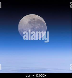 The International Space Station captures a full moon over Earth ...