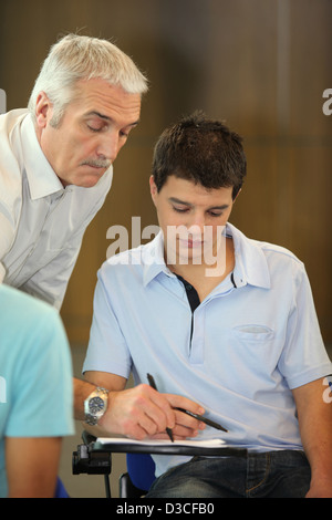 Student correcting homework Stock Photo - Alamy
