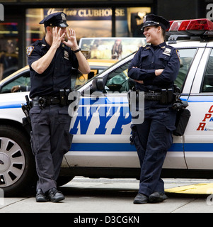 New York State Police officers stand on the field before an NFL ...