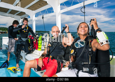 scuba diving. buddy check. Divers check equipment serviceability from ...