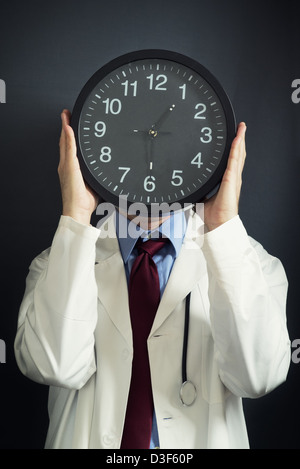 doctor with clock Stock Photo - Alamy