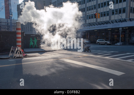 A Con Edison manhole vents excess steam in the Chelsea neighborhood of ...