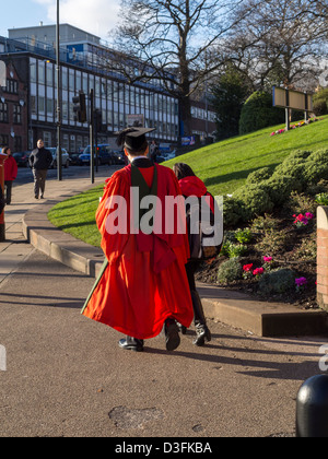 New graduates on graduation day wearing caps and gowns around the ...