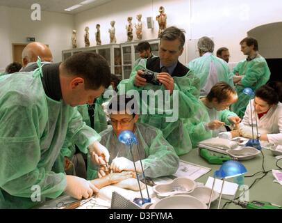 (dpa) - Renowned hand surgeons practice the newest plastic surgery ...