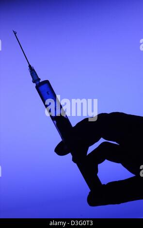(dpa) - The symbolic picture shows an injection filled with a red ...