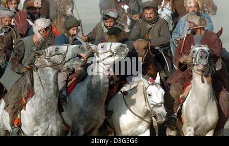 Afghan horsemen take part in the traditional Buzkashi game in Maimana ...
