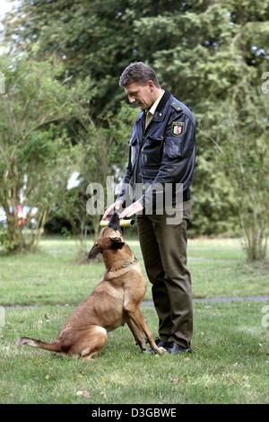 An officer plays with his dog Stock Photo - Alamy