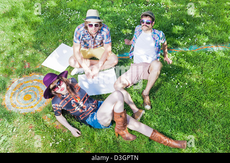 Hipsters and Beatniks - Three hipsters demonstrating while holding ...