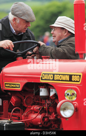Local old men farmers talking chatting tractor tractors farming rural ...