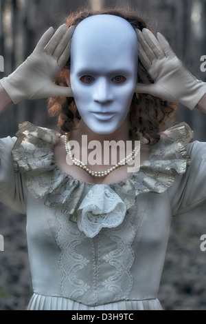 Scary white mask in the dark. Spooky guy in white masquerade. Black ...