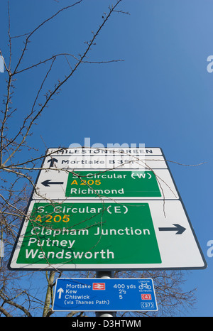 british road sign indicating a junction 100 yards ahead and a side ...