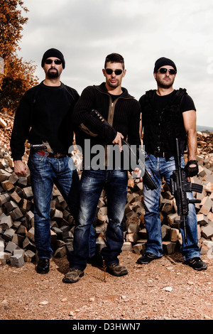 View of a group of gang members with guns Stock Photo - Alamy