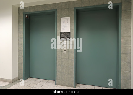 an empty office with two elevators in the middle and one on the other ...