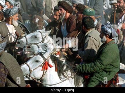 (dpa) - Afghan horsemen gather for a traditional Buzkashi game in ...