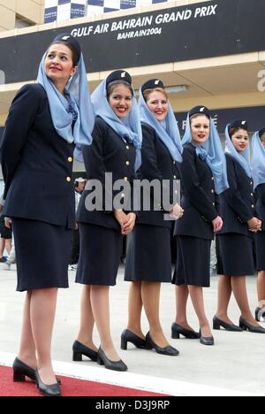 (dpa) - Air hostesses of the Bahrainian airline serve as grid girls on ...