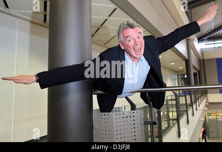 Ryanair CEO Michael O'Leary poses with a slogan at a press conference ...