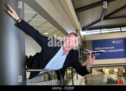 Ryanair CEO Michael O'Leary poses with a Ryanair model plane at a press ...
