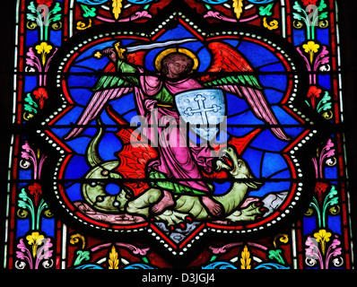 A stained glass window depicting Archangel Michael slaying Satan after ...