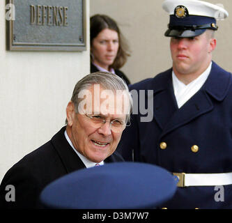 (dpa) - US Defence Minister Donald Rumsfeld is gesturing between the ...