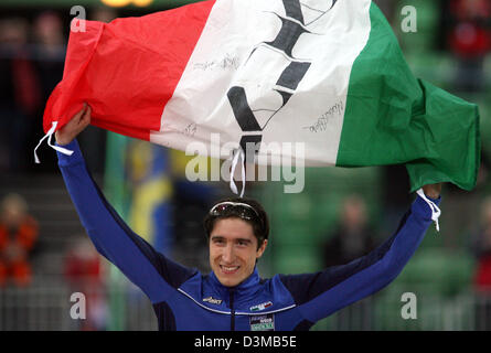 (dpa) - Italian speed skater Enrico Fabris celebrates his victory as ...
