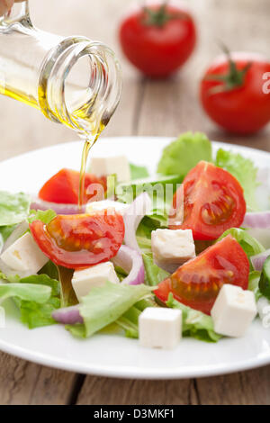oil pouring over fresh salad Stock Photo - Alamy