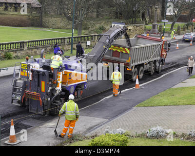 .A road planing machine in action on a road resurfacing job Stock Photo ...