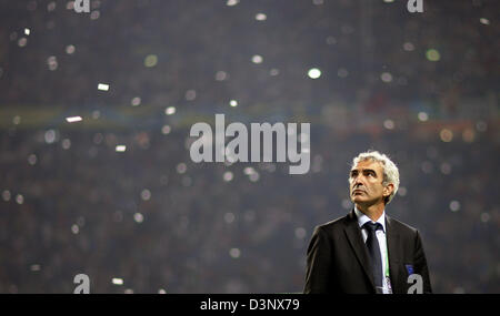 Dejected national coach Raymond Domenech from France stands alone on ...