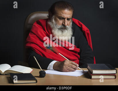 Critic writing review on a book Stock Photo - Alamy