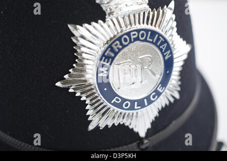Metropolitan police constable helmet and badge with Houses of Stock ...