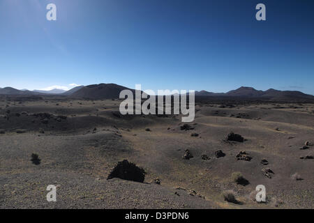 old dried lava flow fields in timanfaya, lanzarote spain Stock Photo ...