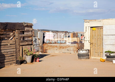 Poor shacks made from scrap wood and sheetmetal seen in the hills ...