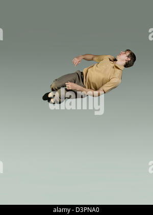 Humans floating frozen in mid air Stock Photo - Alamy