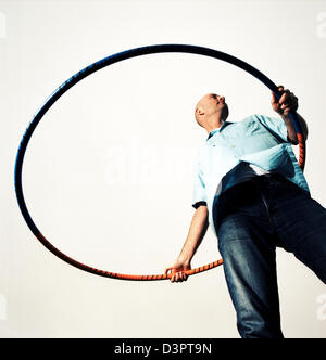 man with a hula hoop Stock Photo - Alamy
