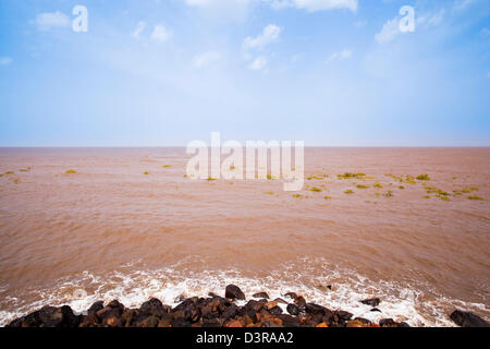 Rocks with muddy water at Ghogha Beach, Bhavnagar, Gujarat, India Stock ...