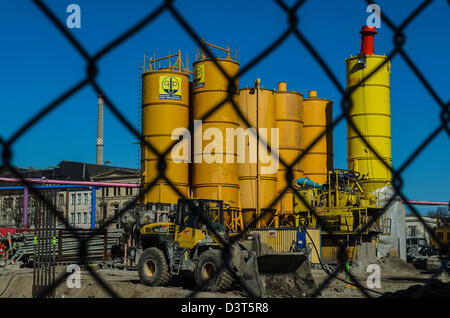 Yellow containers at road construction site Stock Photo - Alamy