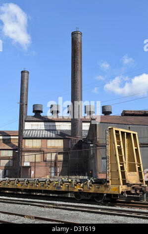 Steel mill buildings and railroad tracks close up, large metal ...