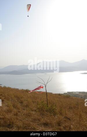 Paraglider and windsock Stock Photo - Alamy