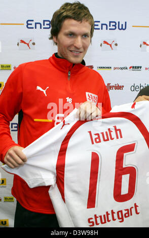 German striker Benjamin Lauth (L) presents his new jersey with German ...