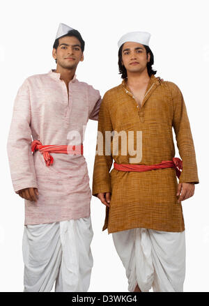 TWO MEN ARE STANDING TOGETHER IN A OFFICE TAKING A PICTURE Stock Photo ...
