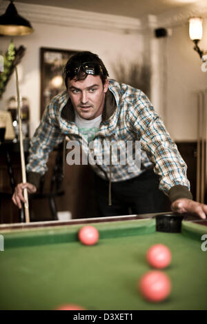 Pool player at billiards table, St Agnes, Cornwall, UK Stock Photo - Alamy