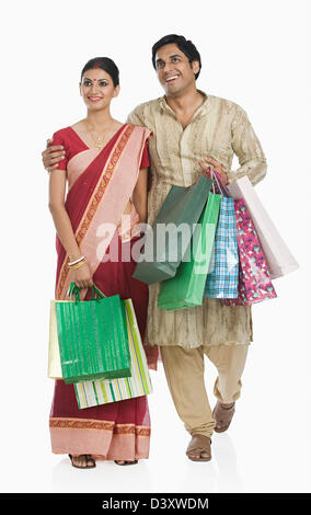 Bengali couple carrying shopping bags Stock Photo - Alamy