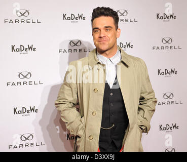 British singer Robbie Williams poses for photographers as he arrives to ...