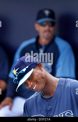 Tampa Bay Rays' Tim Beckham, right, points to his dugout next to third ...