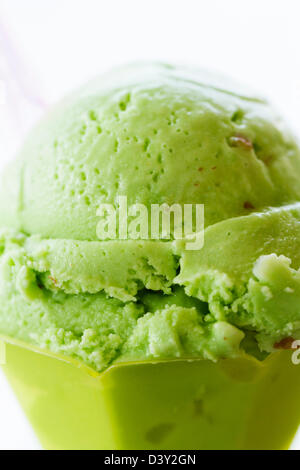 Green gelato in green plastic cup Stock Photo - Alamy