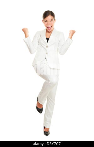 young Asian woman celebrating work success sitting on sofa with laptop ...