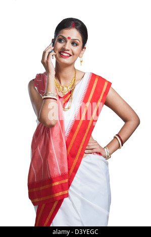 Bengali woman standing with her hand on chin Stock Photo - Alamy