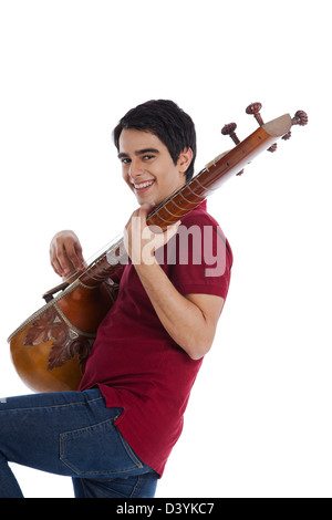 Man playing a sitar and smiling Stock Photo - Alamy