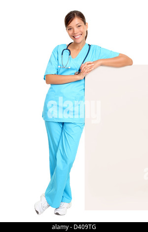 Young Woman standing in empty office with big windows taking selfie on ...