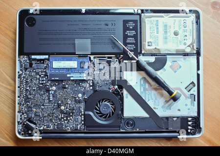 Apple Macbook Pro with base removed, showing internal components ...