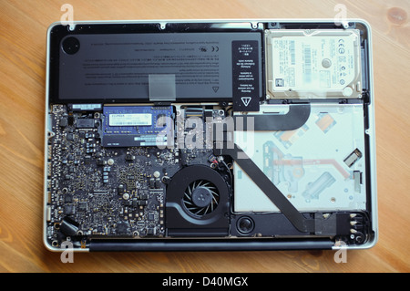 Apple Macbook Pro with base removed, showing internal components ...